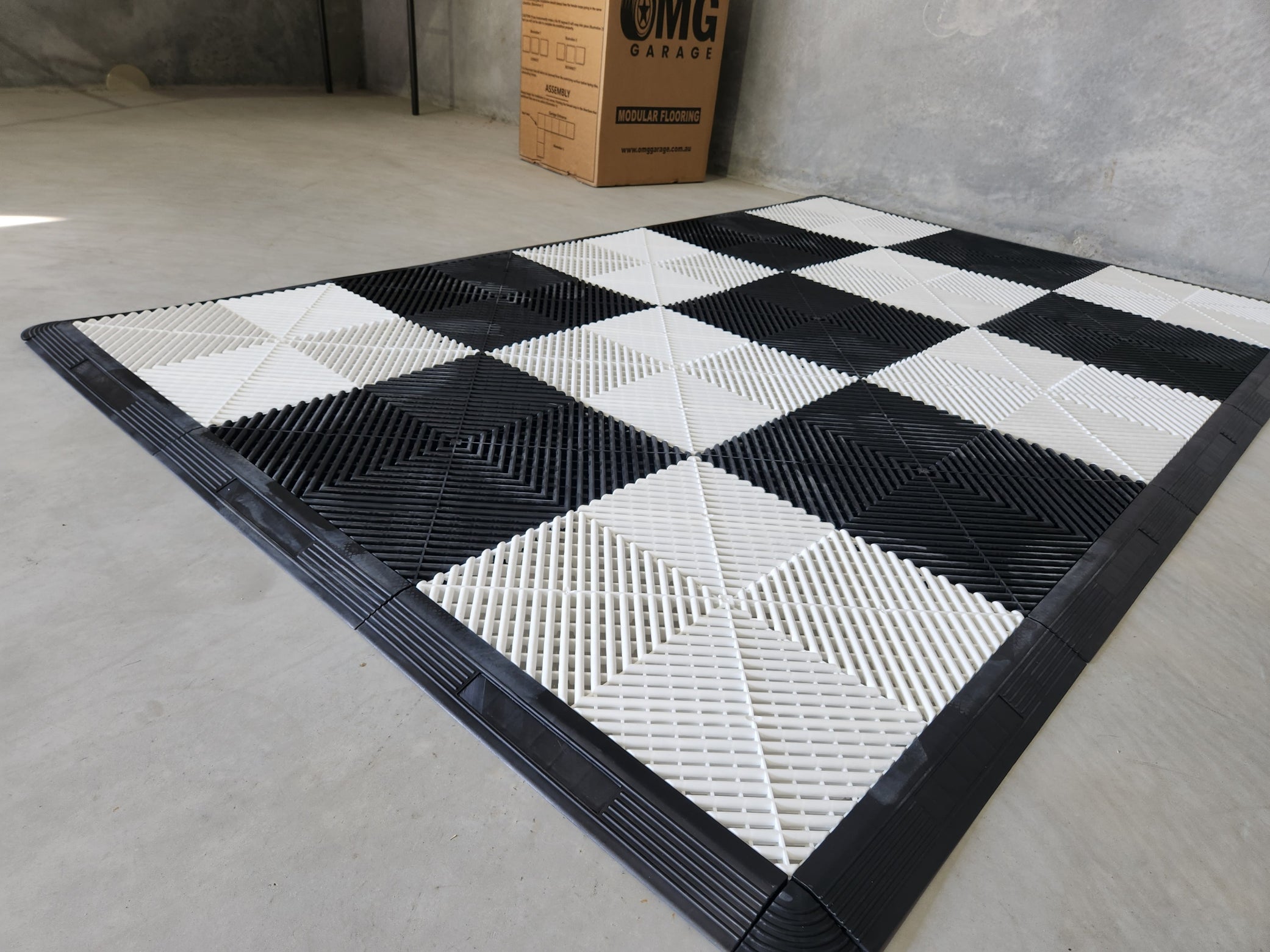 Motorbike Pad Modular Floor Tiles | OMG Garage | Shop now